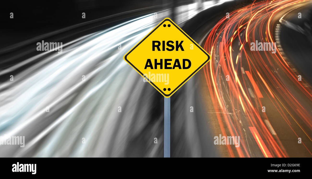 "RISK AHEAD" sign against highway trails Stock Photo - Alamy
