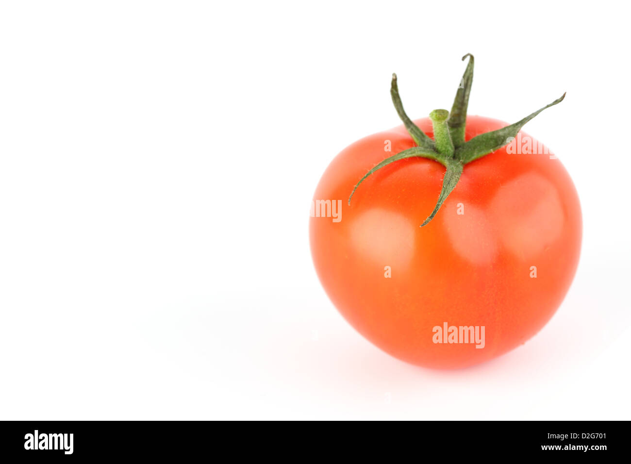 one tomato on white Stock Photo - Alamy