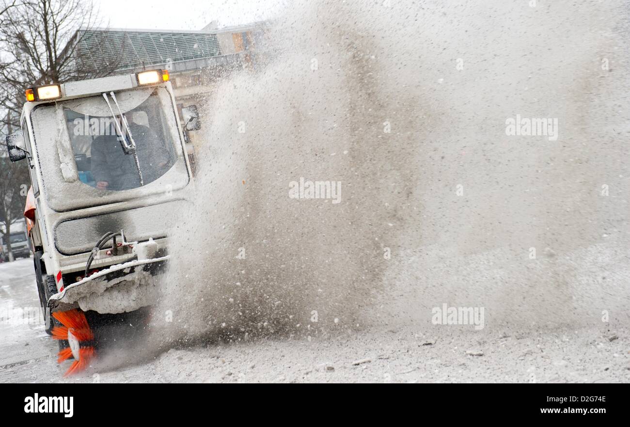 A snowplow clears a sidewalk of ice and snow in Berlin, Germany, 21 ...