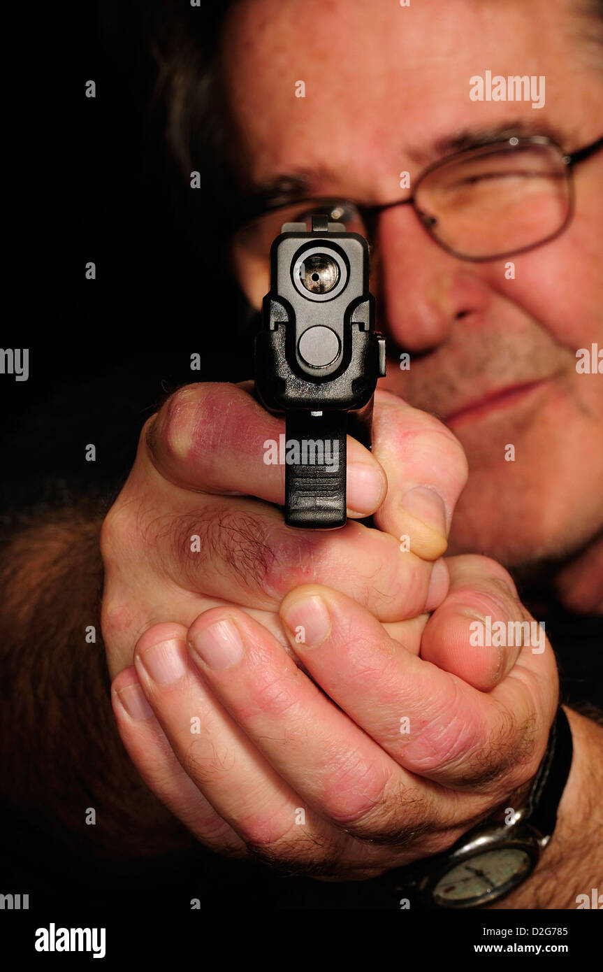 Man aiming semi-automatic pistol Stock Photo - Alamy