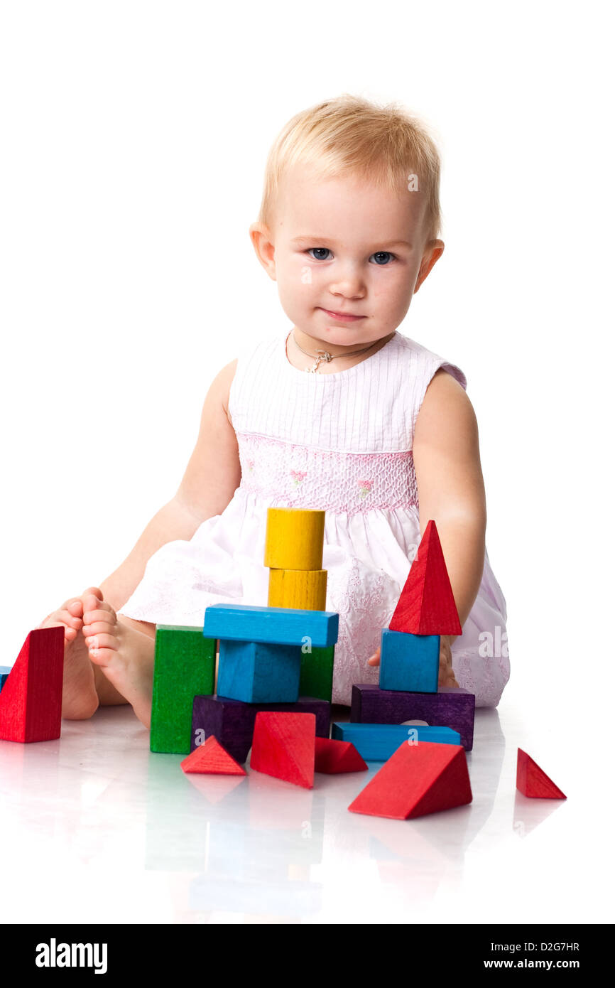 Beautiful baby building a castle with cubes isolated on white Stock ...