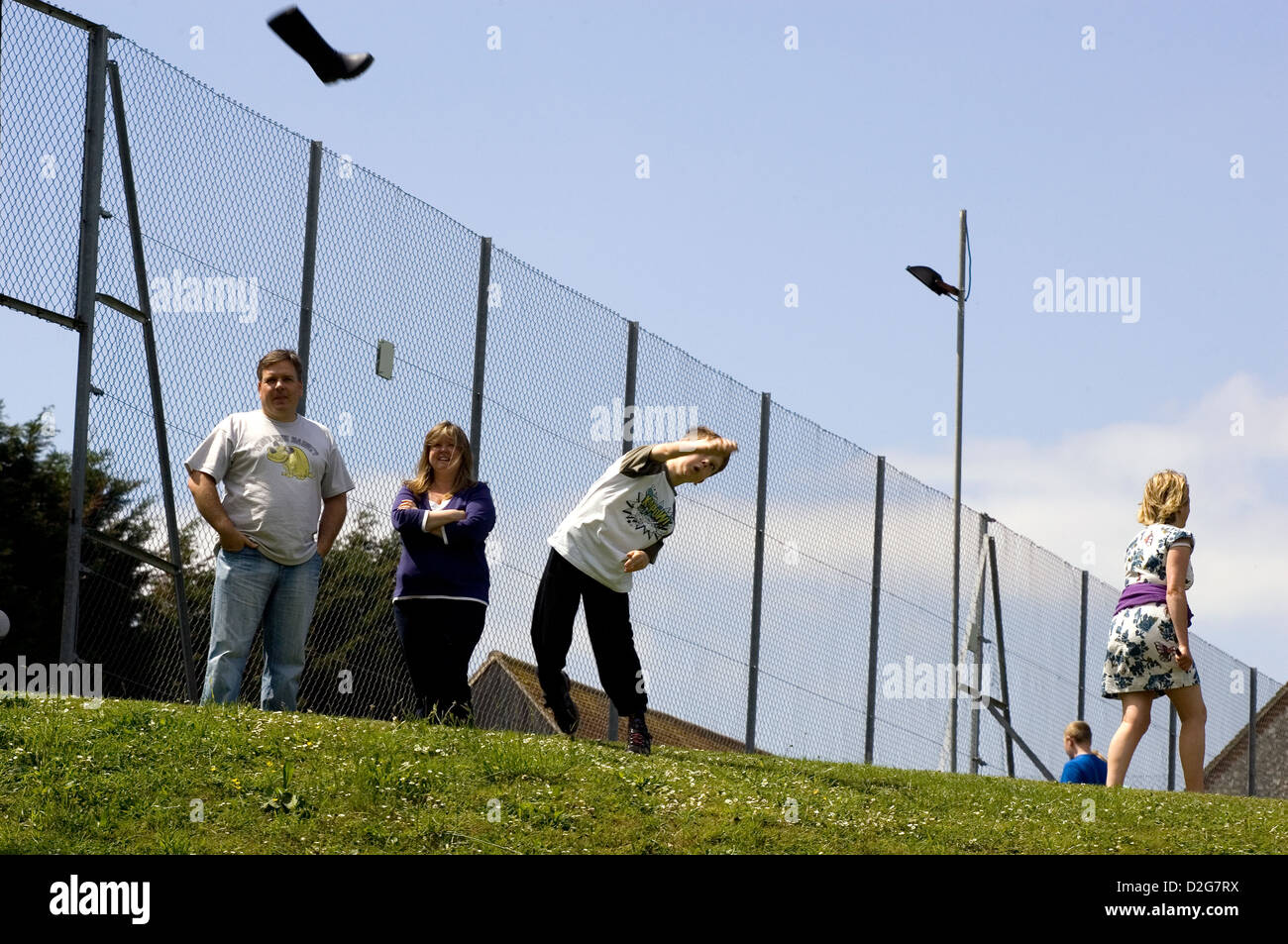 Members of the public enjoy the attractions at a traditional English ...