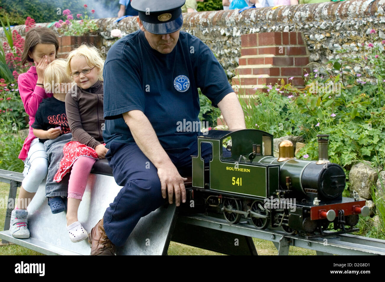 Members of the public enjoy the attractions at a traditional English ...