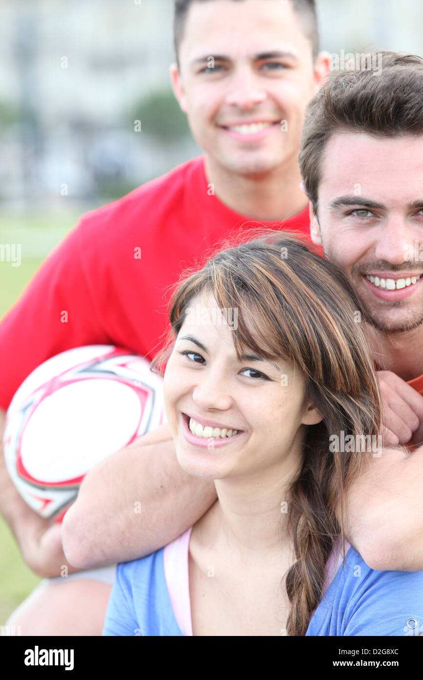 friends playing soccer Stock Photo - Alamy