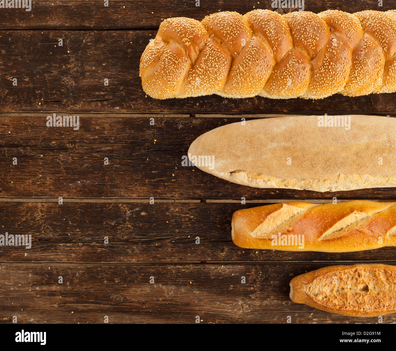 Variety types of bread on wood table Stock Photo - Alamy