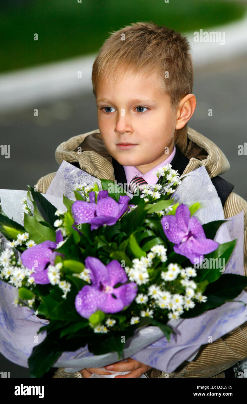 Little boy with a bouquet of flowers Stock Photo - Alamy