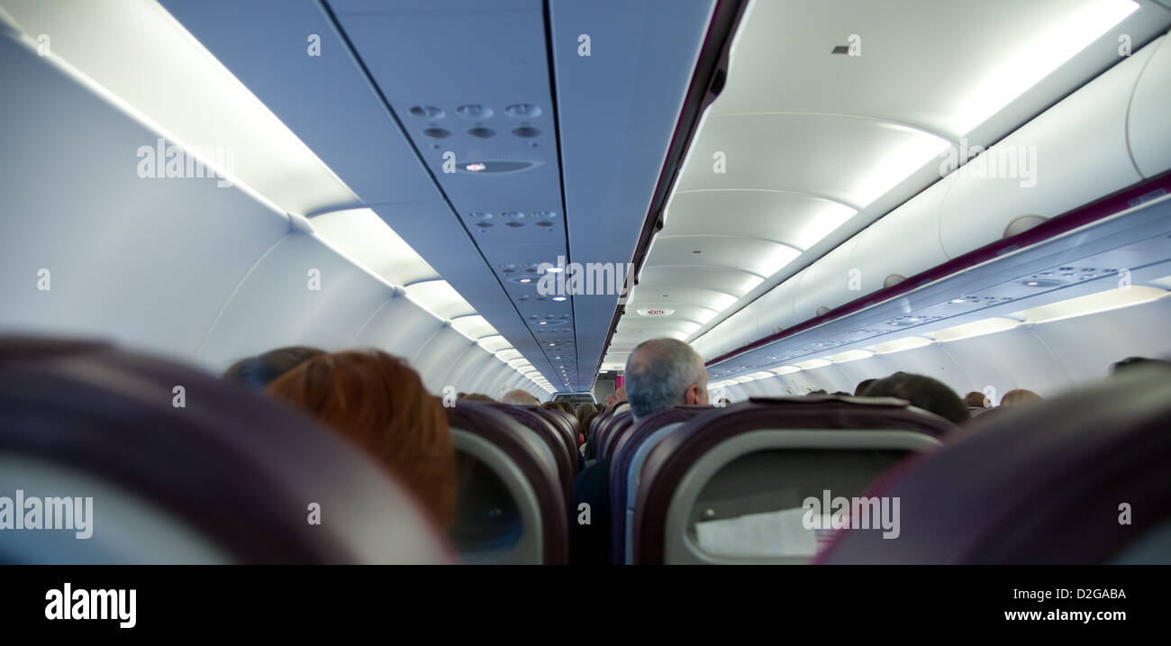 Passengers inside airplane hi-res stock photography and images - Alamy