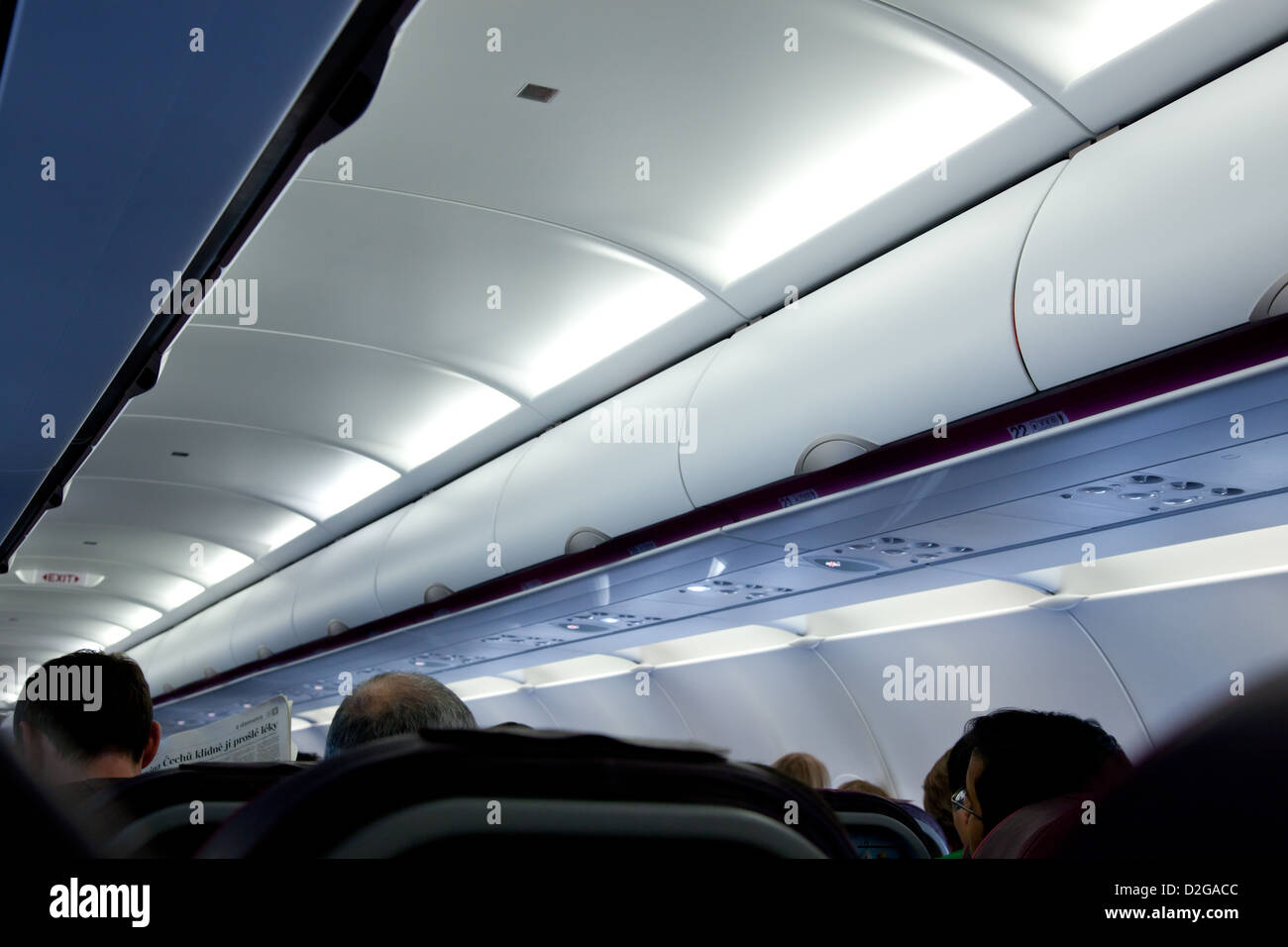 Passengers inside airplane hi-res stock photography and images - Alamy