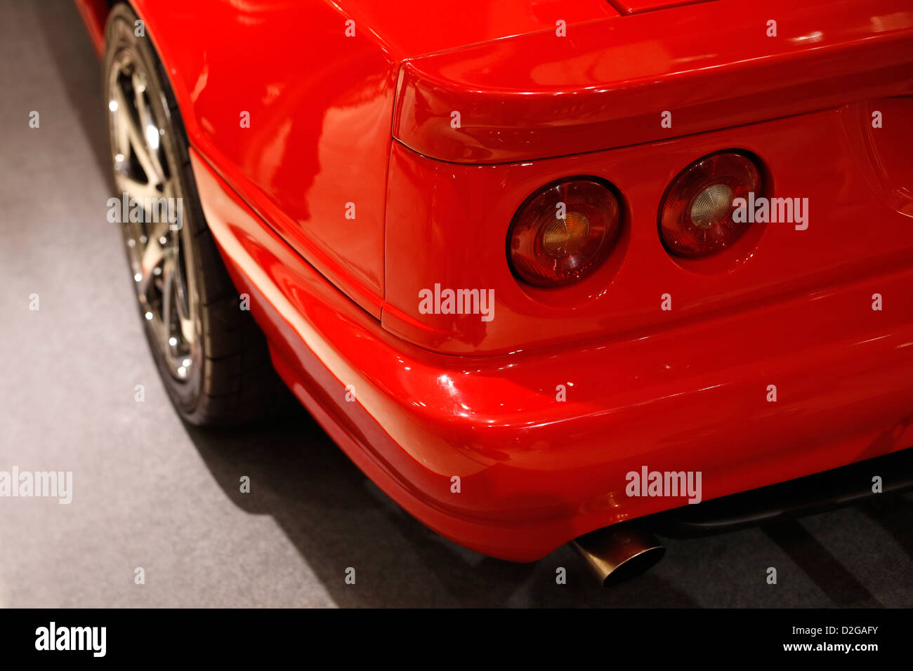 Back part of the red automobile at an exhibition Stock Photo - Alamy