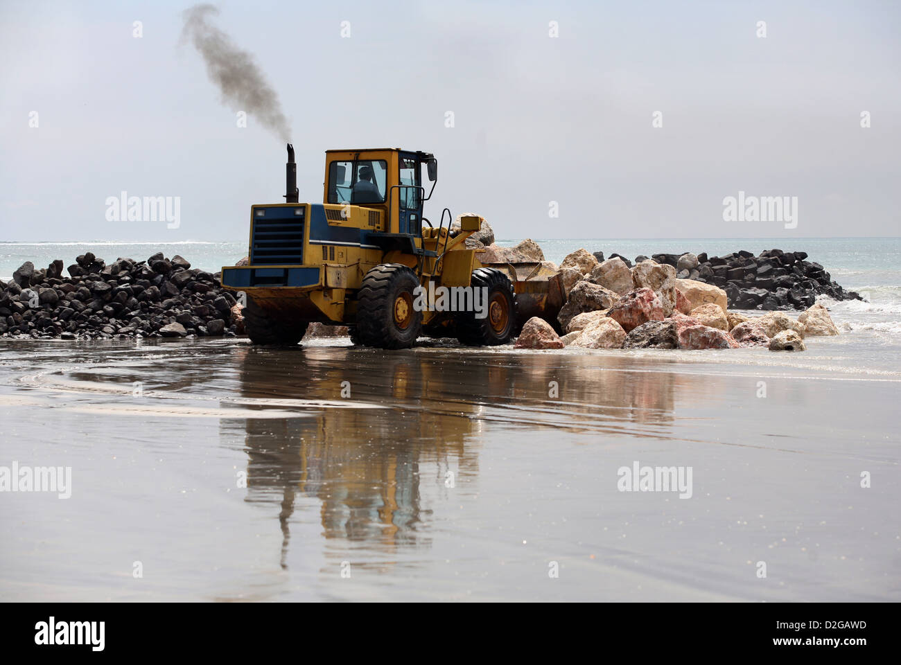 A view of a big bulldozer on coastline Stock Photo - Alamy