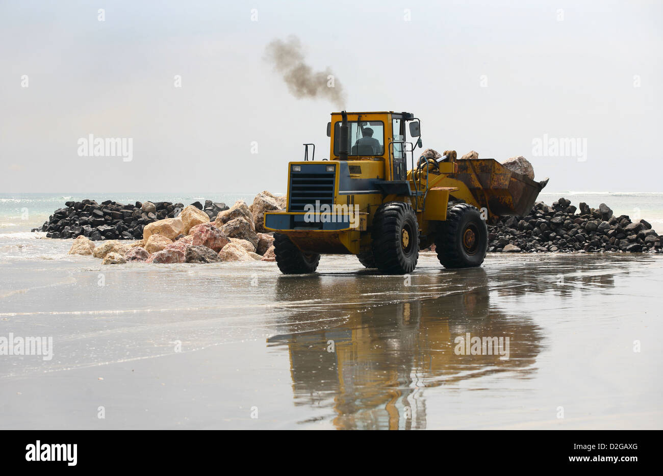 A view of a big bulldozer on coastline Stock Photo - Alamy