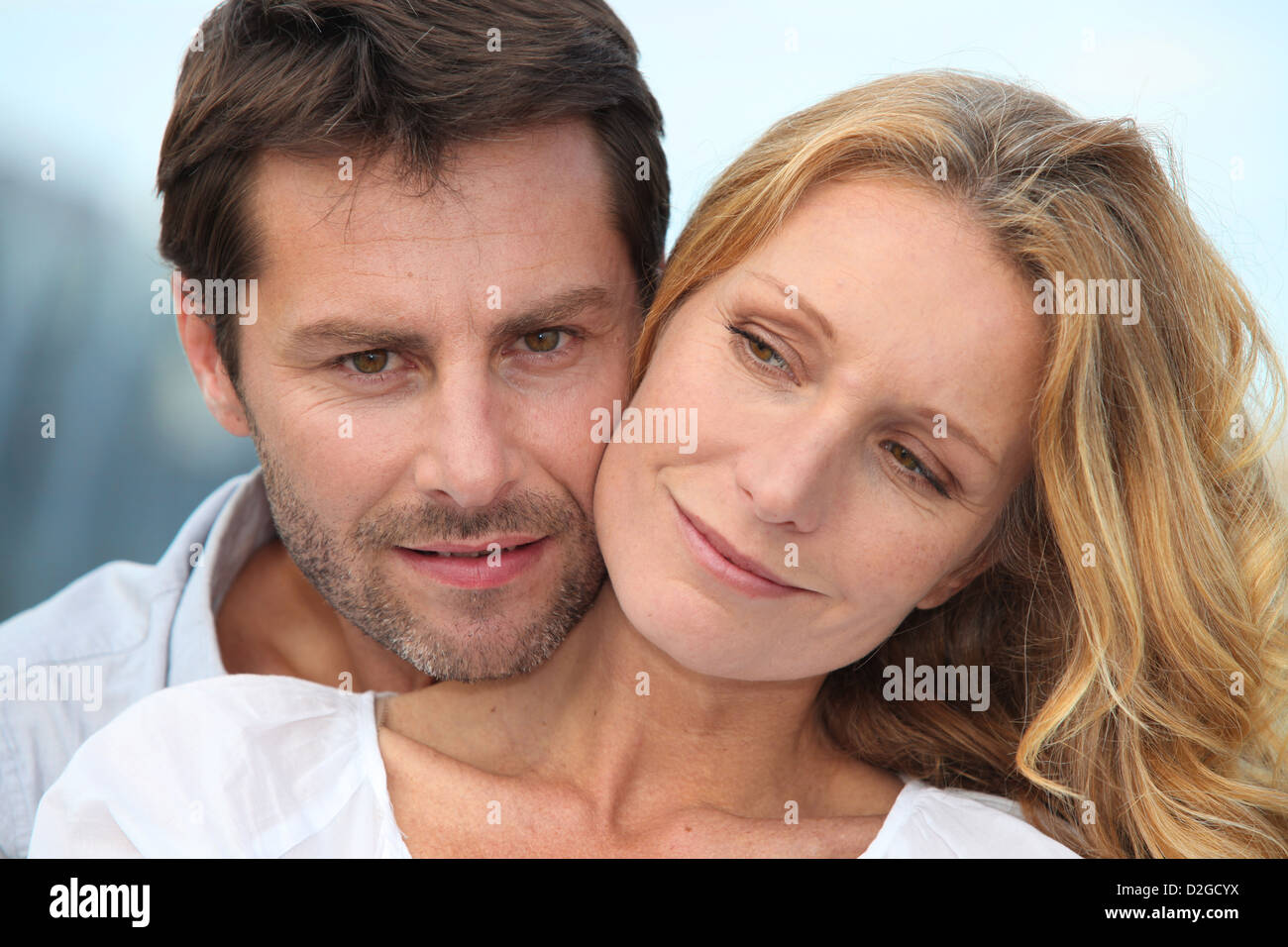 couple with their heads together Stock Photo - Alamy