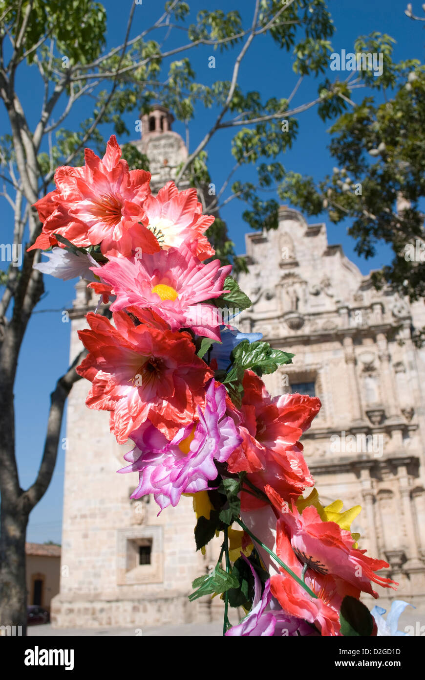 Imitation flowers on sale in a plaza in front of the Cathedral in ...