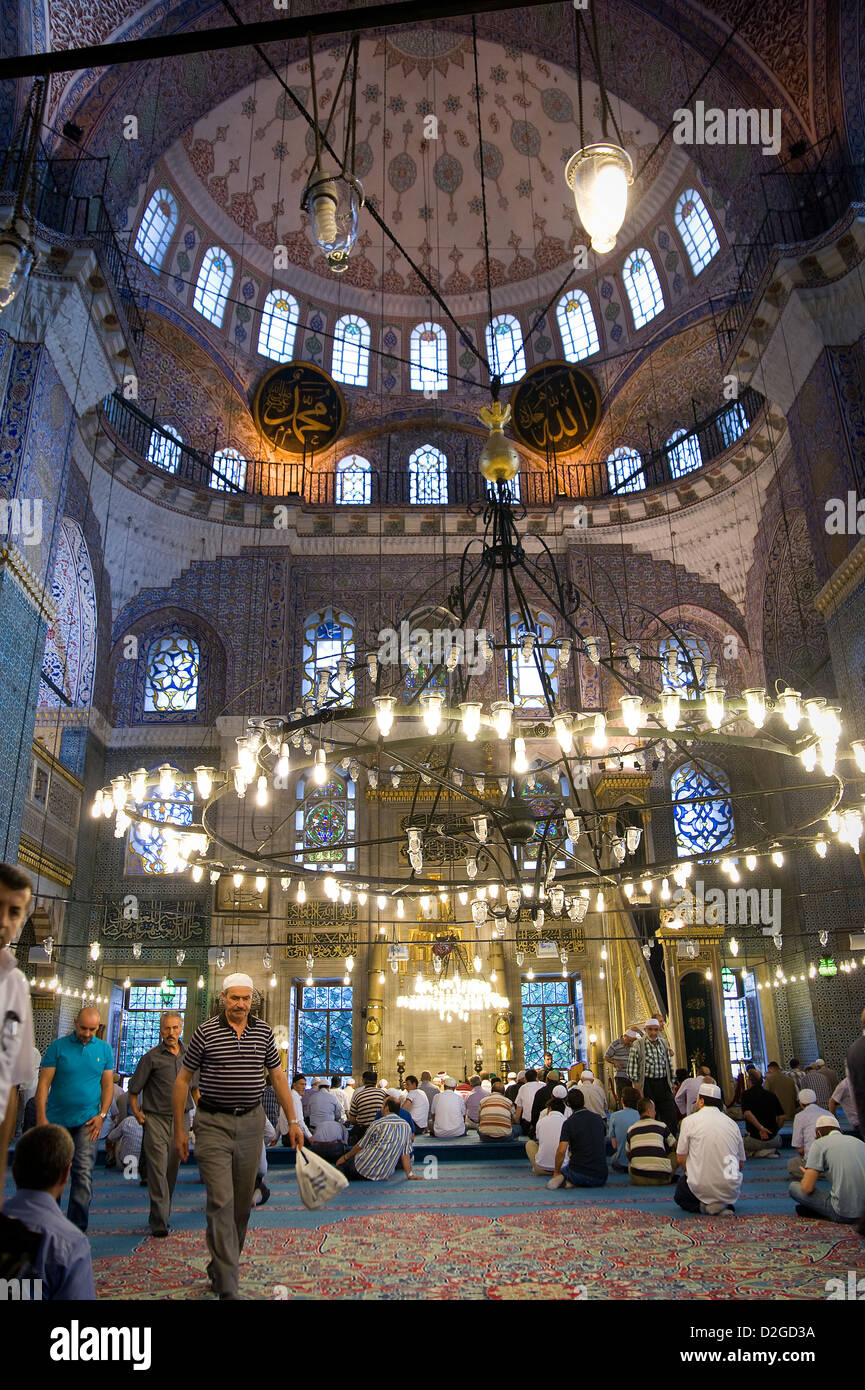 Muslim men praying in Yeni (New) Mosque in Eminonu, Istanbul Stock ...
