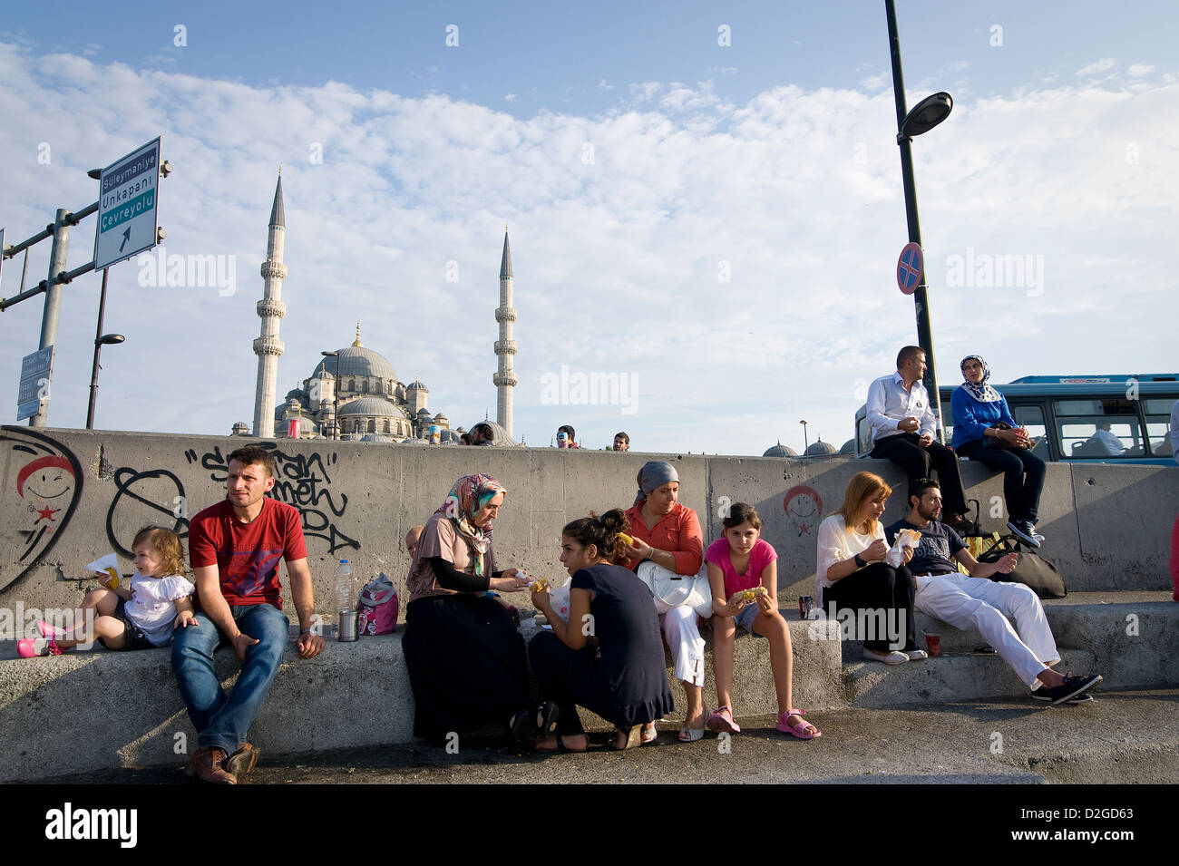 Istanbul: People enjoying an afternoon in the sun in Eminonu beside ...