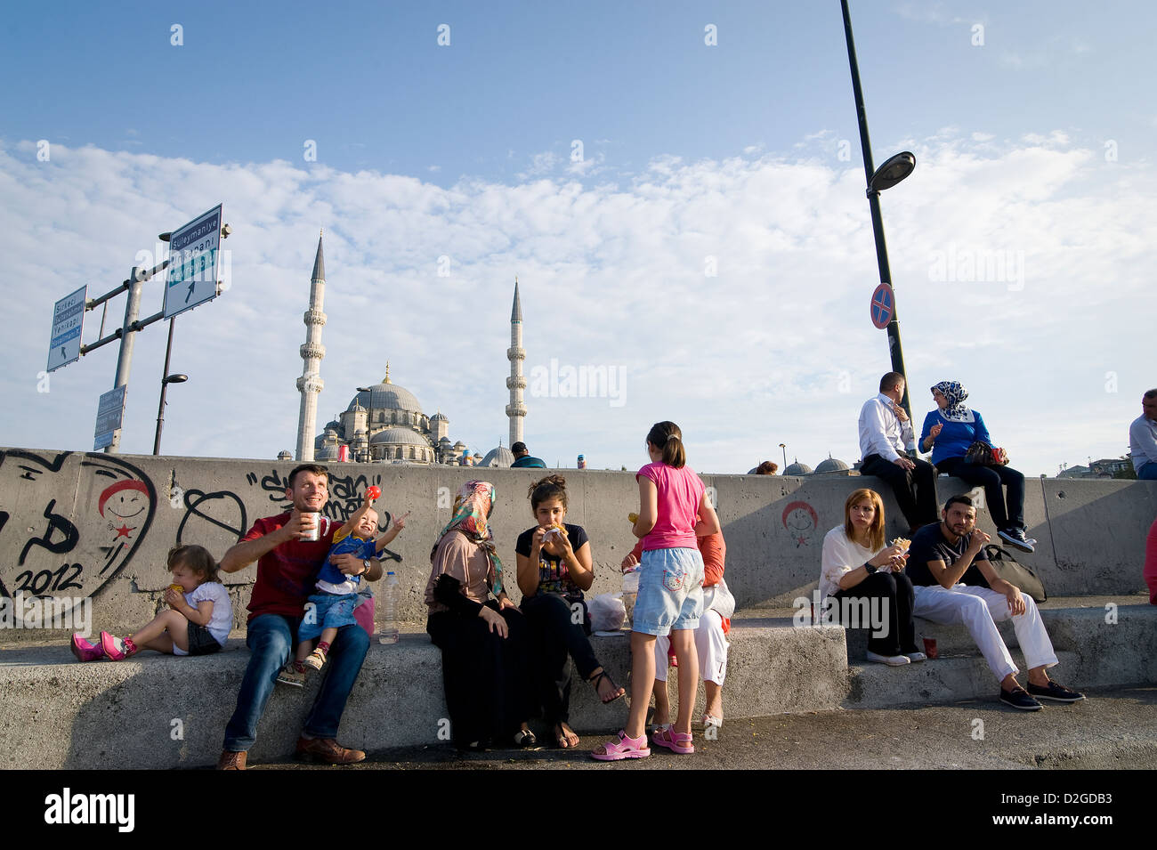 Istanbul: People enjoying an afternoon in the sun in Eminonu beside ...