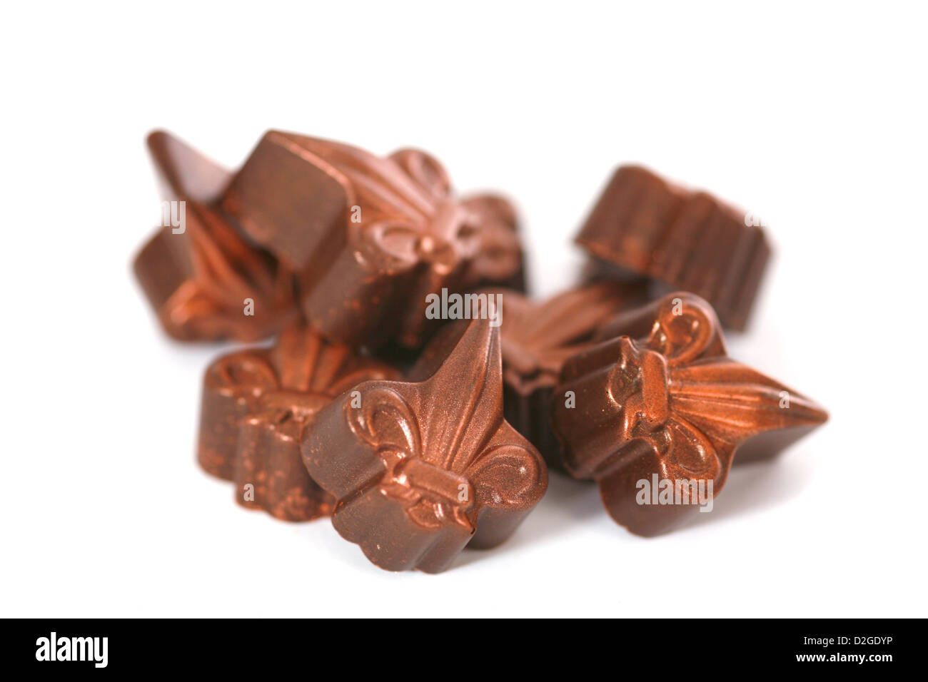 A pile of handmade designer chocolates with gold dust Stock Photo - Alamy