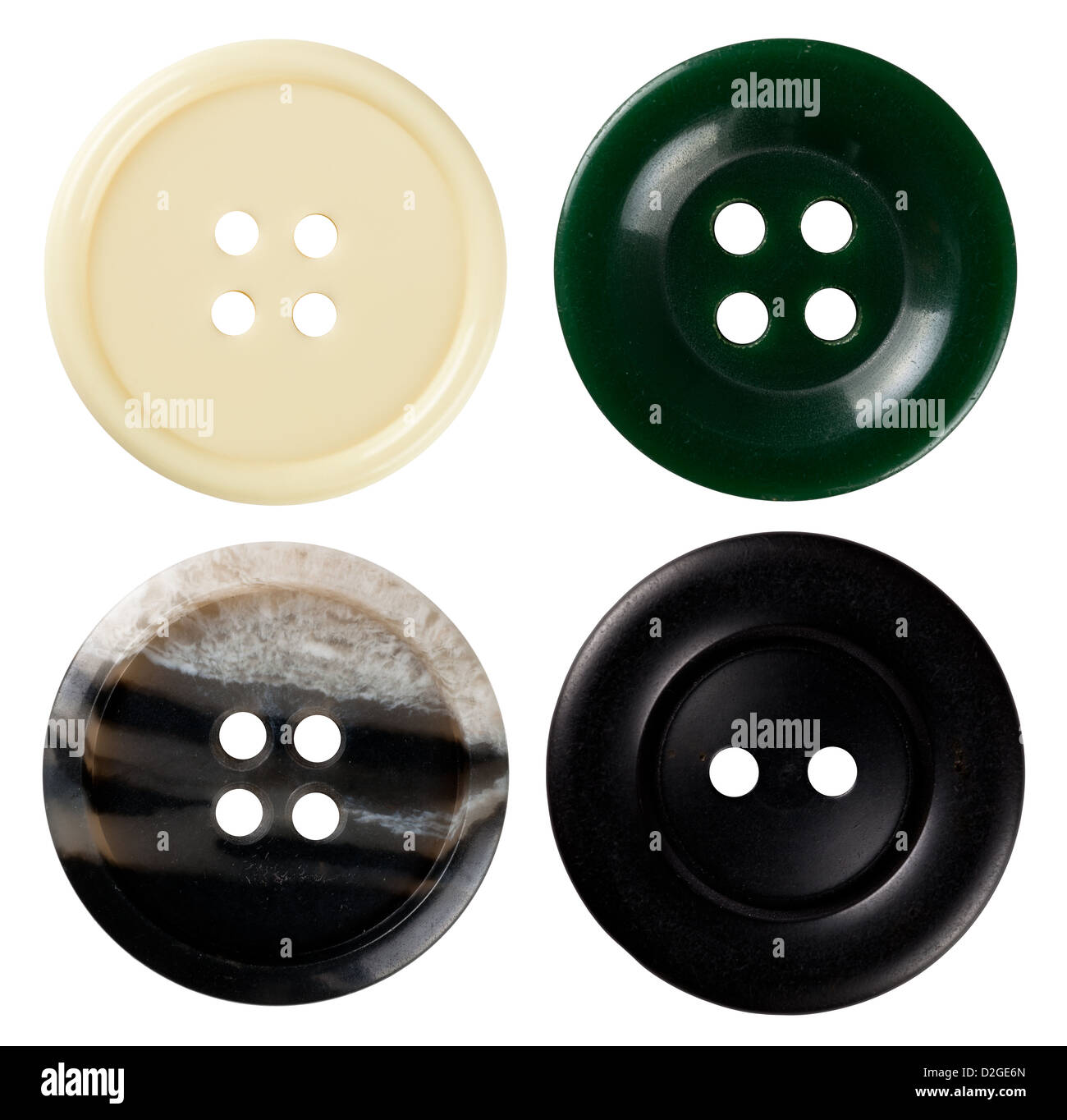 Four varied sewing buttons isolated on white background. Each one is ...