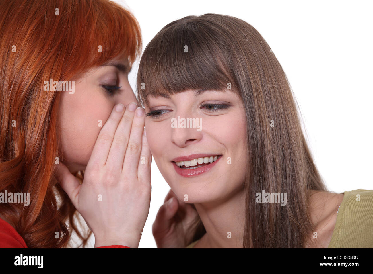Two girls gossiping Stock Photo - Alamy