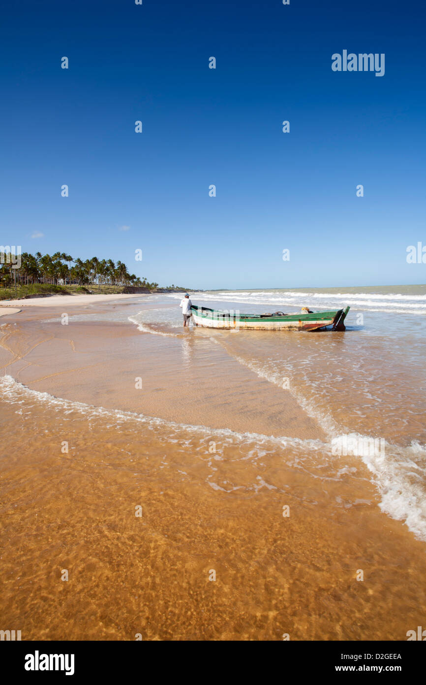 A fishing boat on a lonely beach in Bahia Stock Photo - Alamy