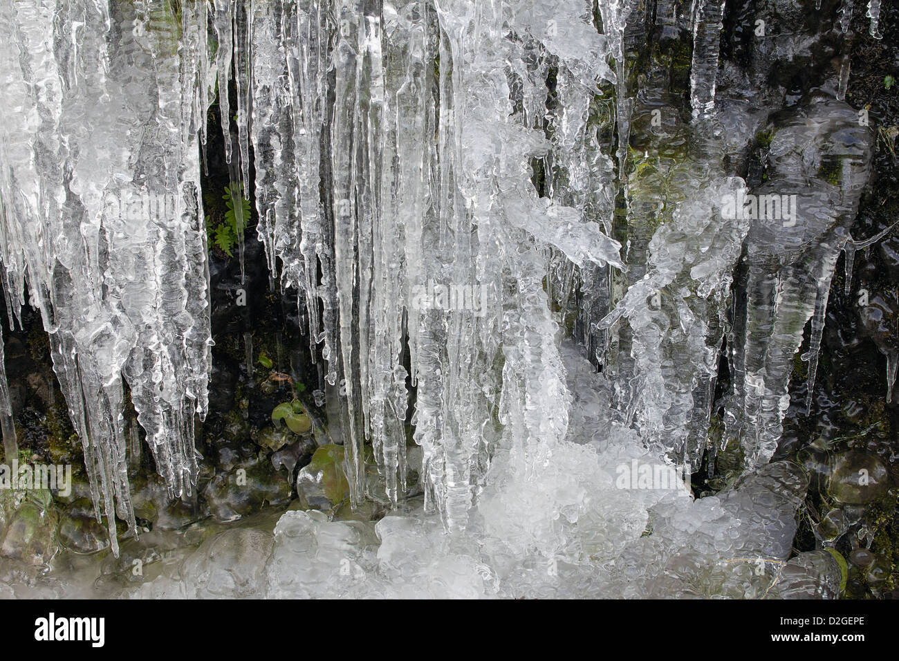 Icicles Formation on Side of Mountain Cave Rocks in Winter Background ...