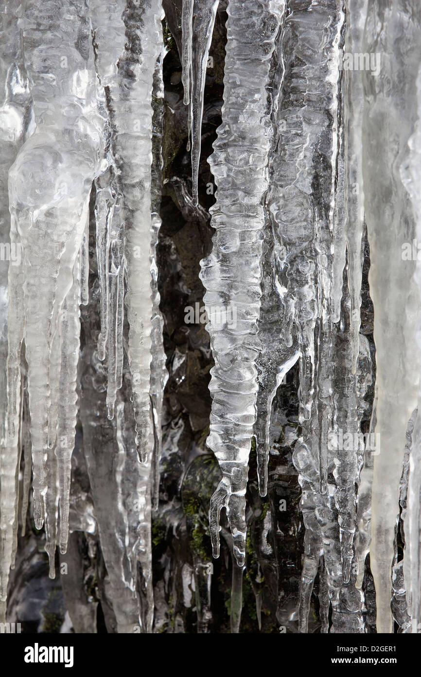 Icicles on Side of Mountain Cave Rocks in Winter Background Stock Photo ...