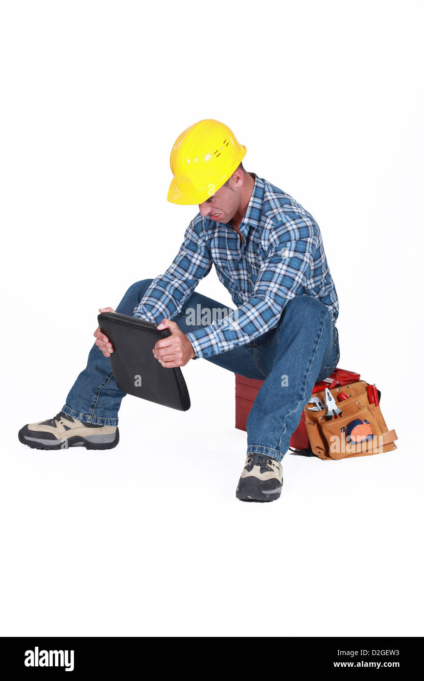 Construction worker sat on his tool box Stock Photo - Alamy