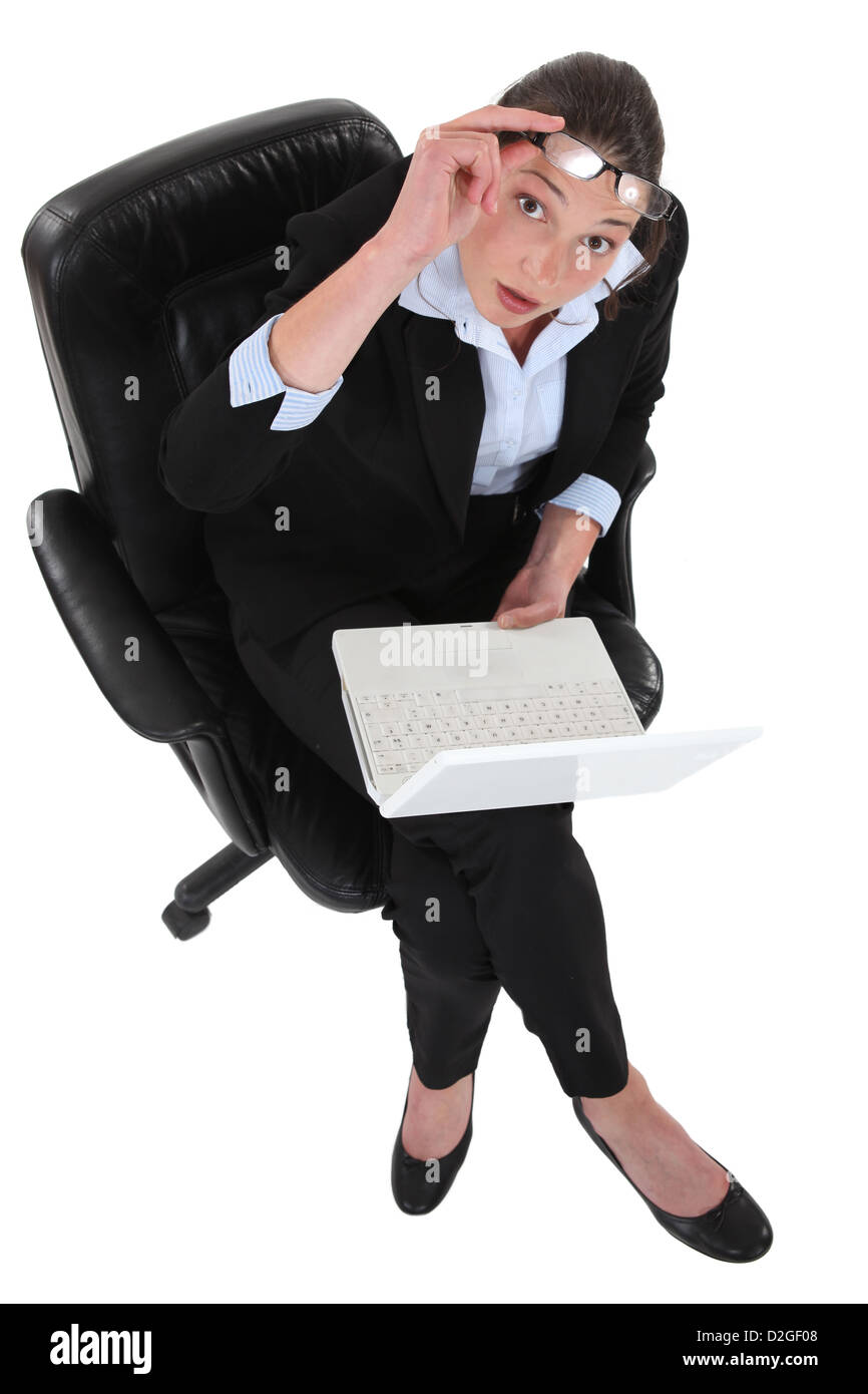 High-angle shot of a businesswoman peering upwards Stock Photo - Alamy