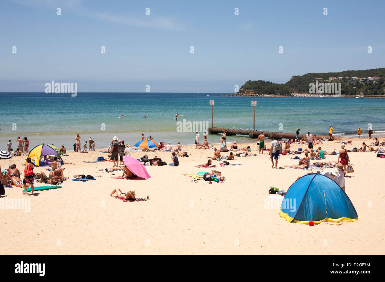 Crowded beach full of sunbathers and swimmers at Australia's iconic ...