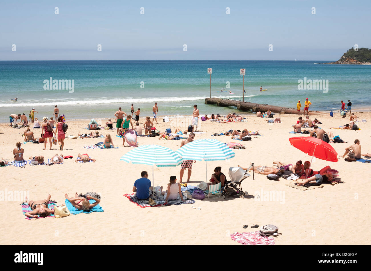 Crowded beach full of sunbathers and swimmers at Australia's iconic ...
