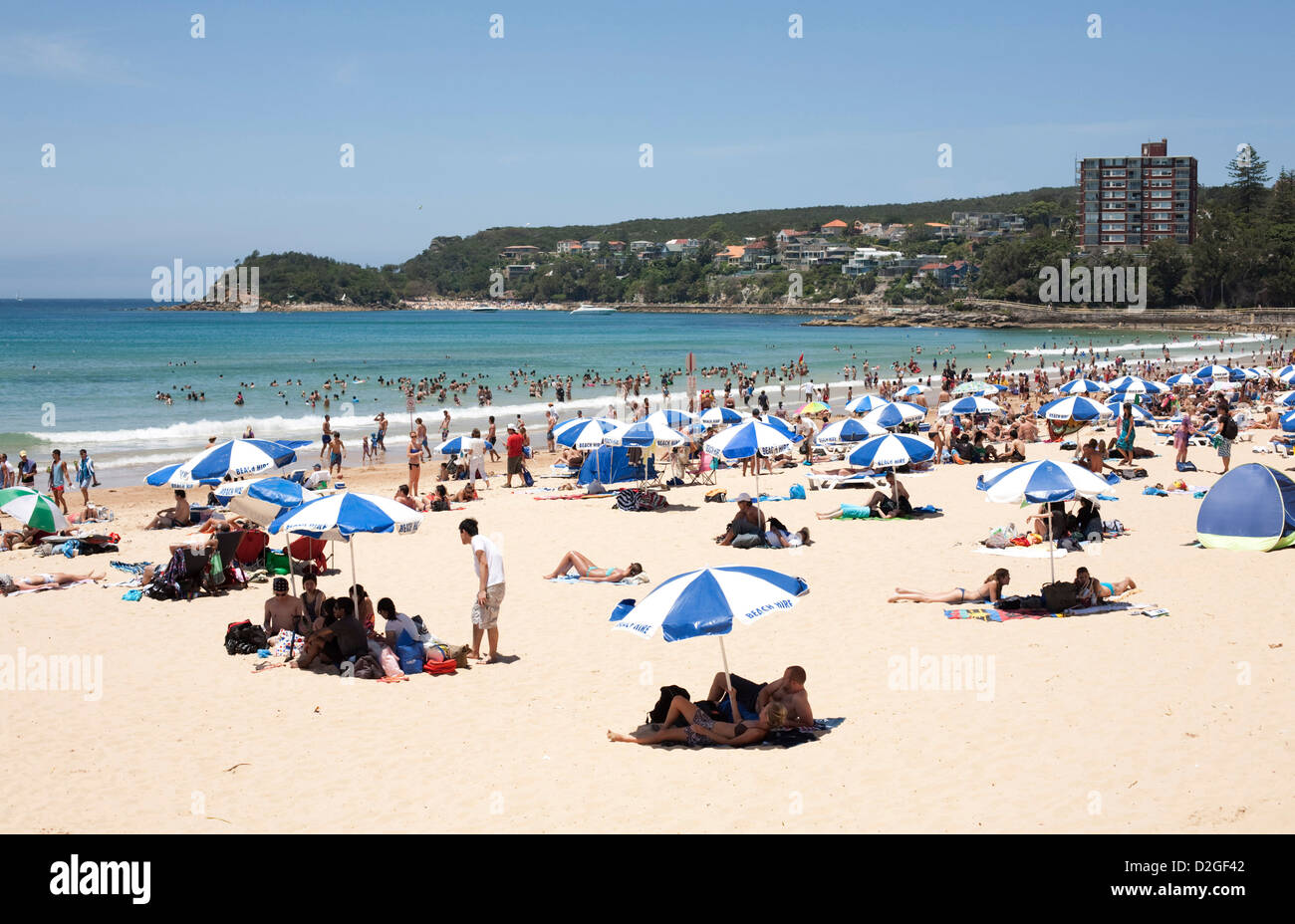 Crowded beach full of sunbathers under hired umbrella's at Australia's ...