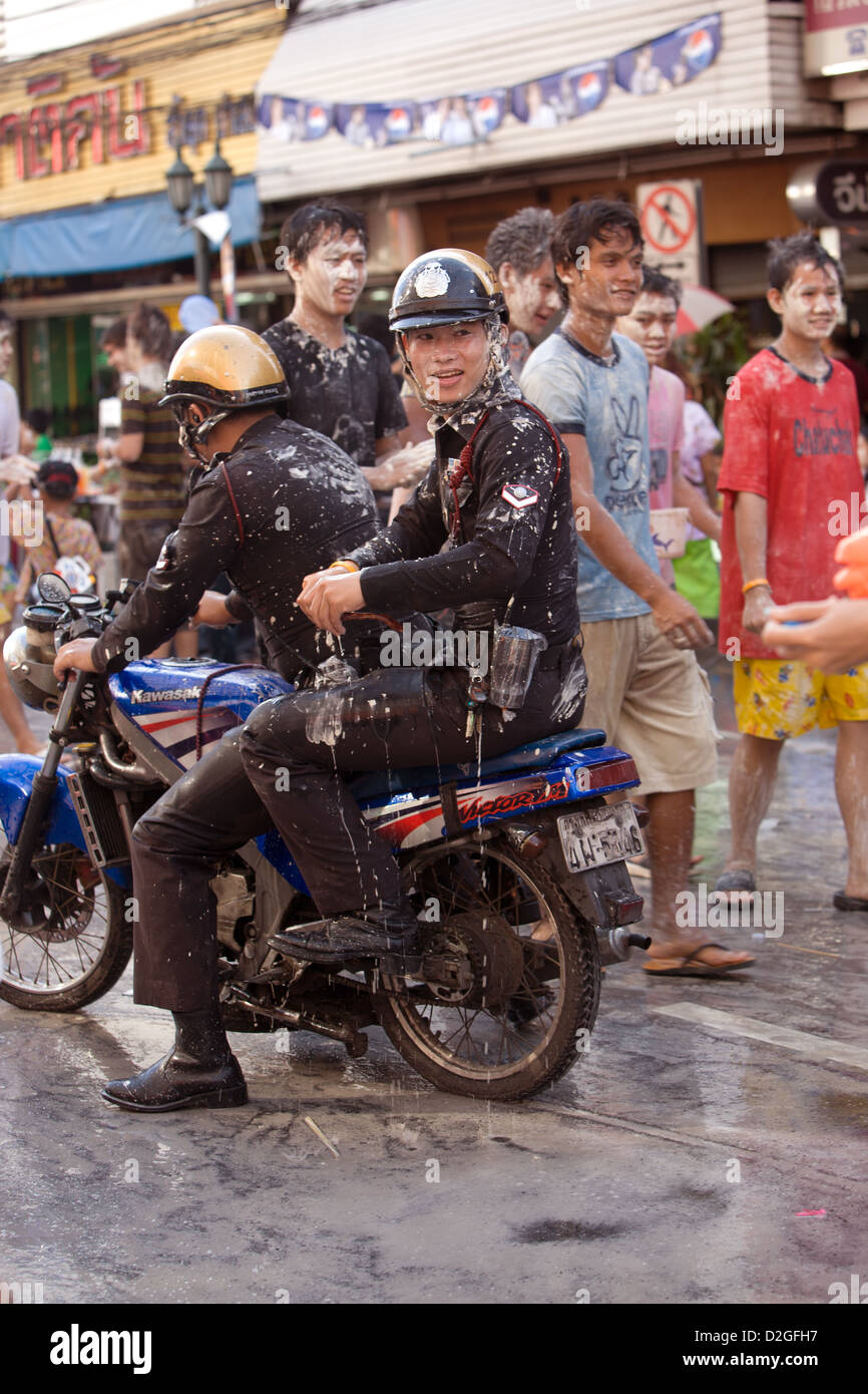 policeman, on motorcycle during the Thai new year Songkran festival ...