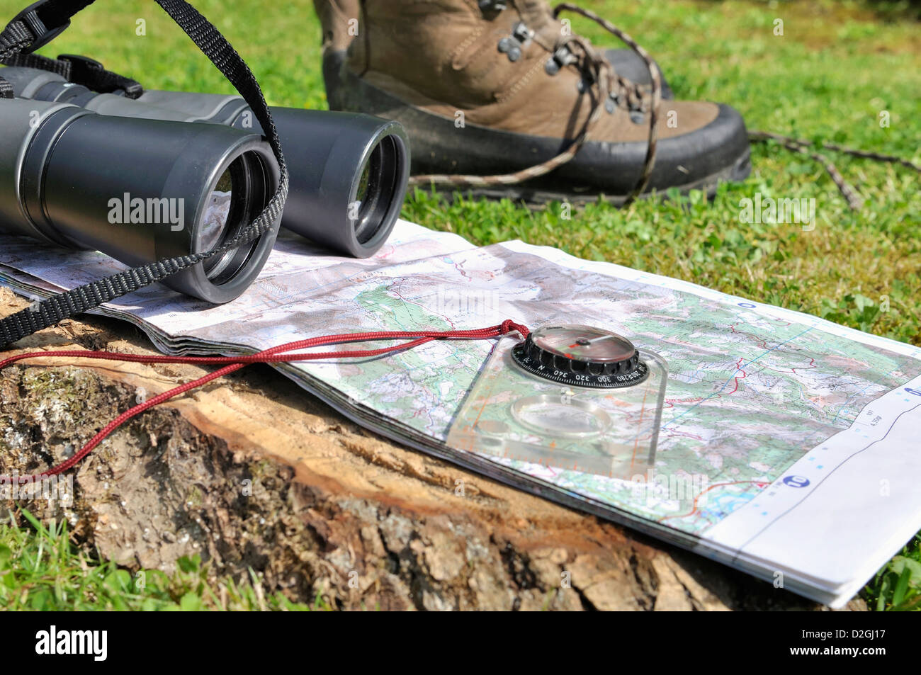 map, compass, binoculars and walking shoes to prepare a trekking Stock ...