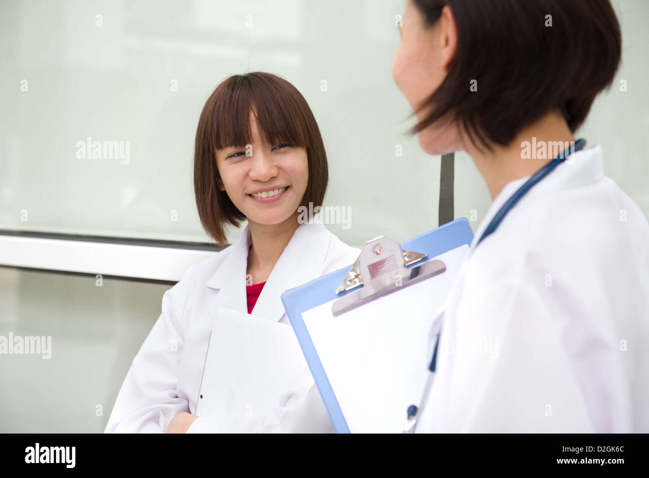 chinese female medical student in a discussion Stock Photo - Alamy
