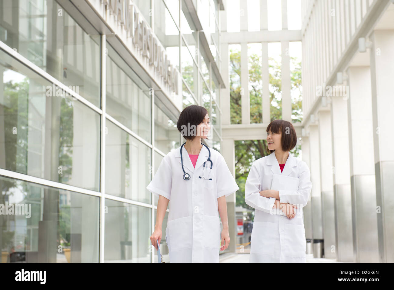 south east asian female doctors walking Stock Photo - Alamy