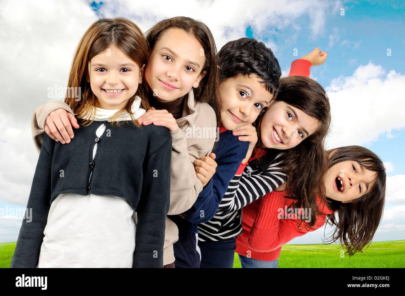 Group of children posing outdoors Stock Photo - Alamy