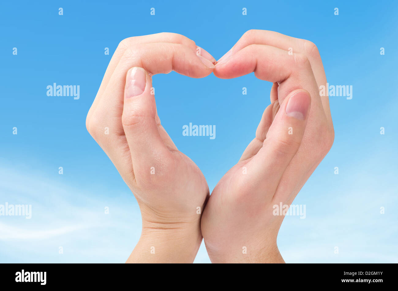 Two hands form a heart shape with their fingers Stock Photo - Alamy