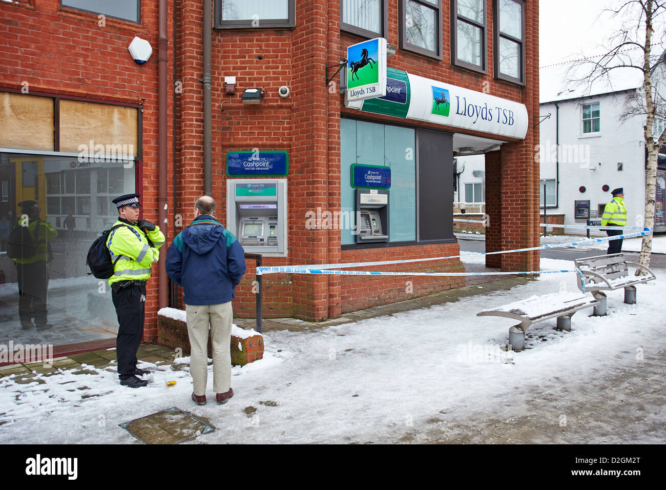 Police officers guard the scene of an armed bank robbery at Lloyds TSB ...