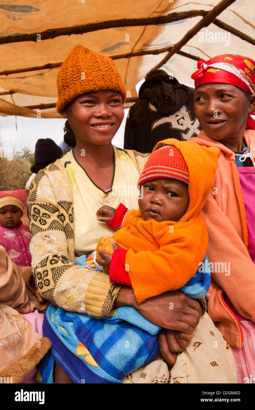 Madagascar, Sahanivotry, young mother with baby in arms Stock Photo - Alamy