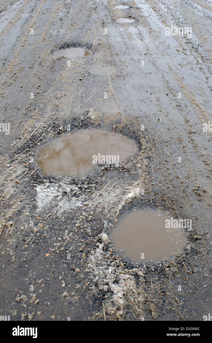 Potholes in road due to frost and snow. West Sussex, UK January Stock ...