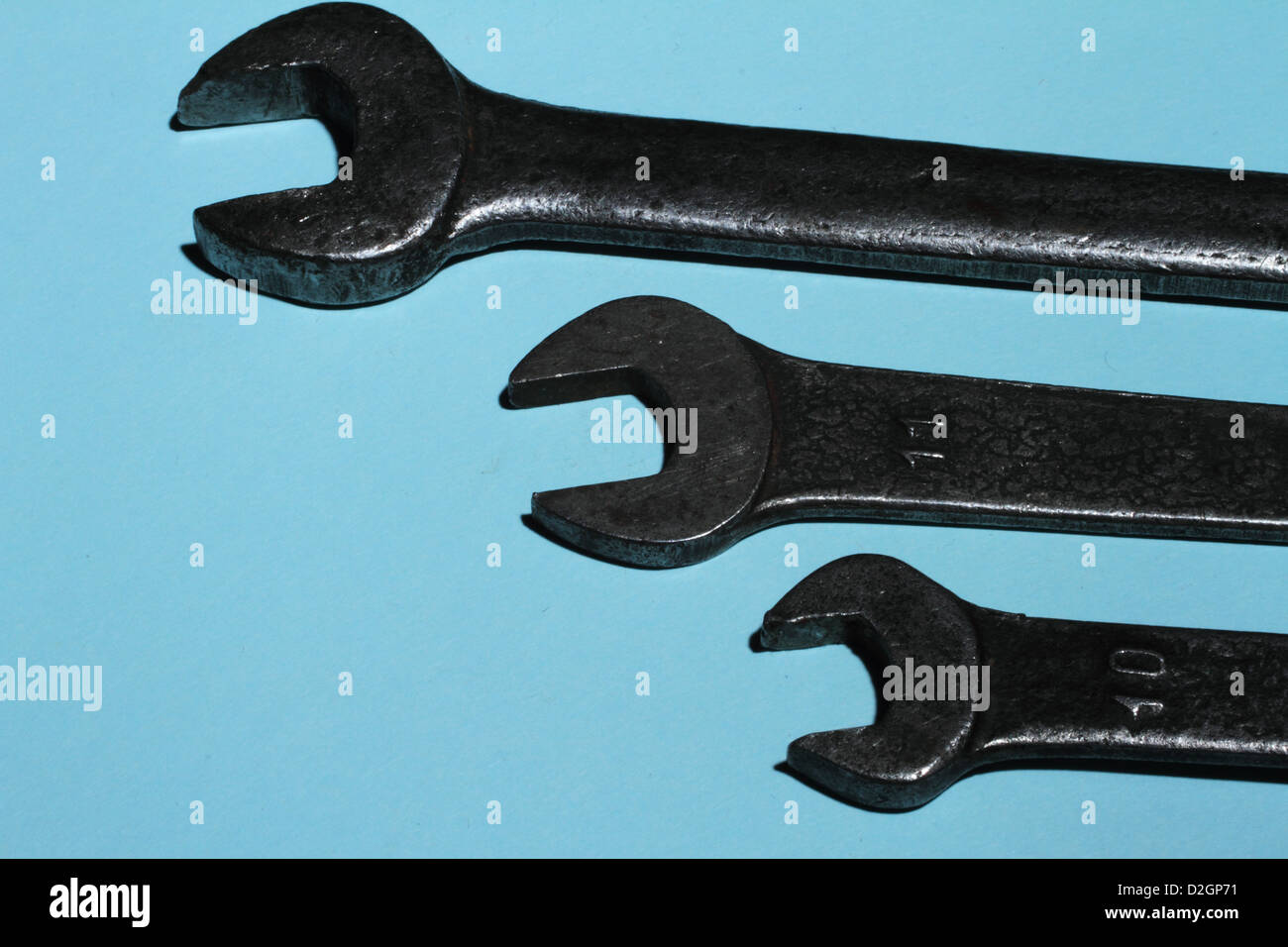 old spanners over blue Stock Photo - Alamy