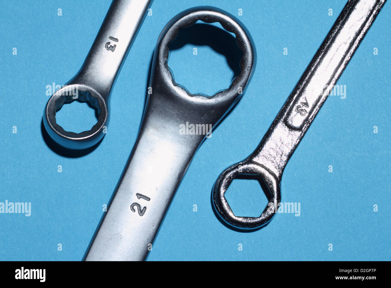 old spanners over blue Stock Photo - Alamy