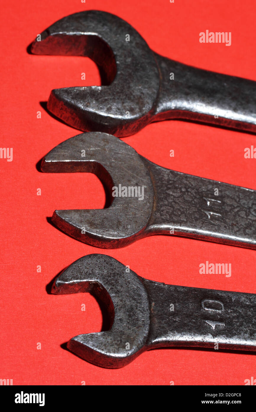 old spanners over red Stock Photo - Alamy