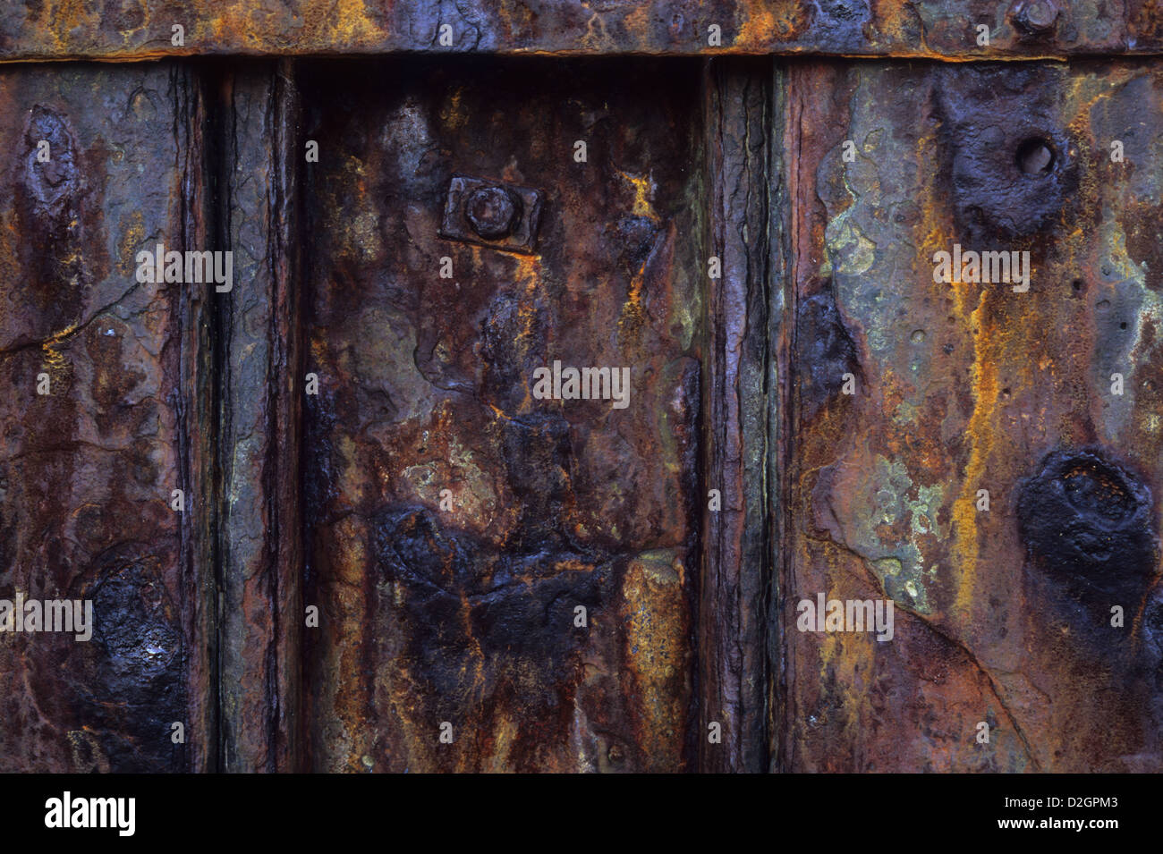 Detail of metal sea defence with heavy duty bolt and showing flaking ...