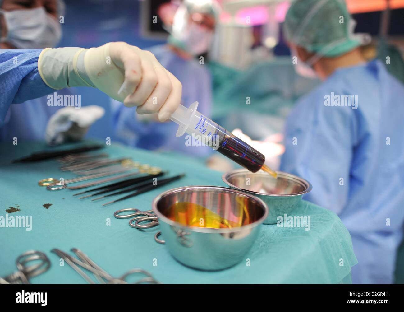 Prepared surgical instruments lay on a table in the operating room of ...