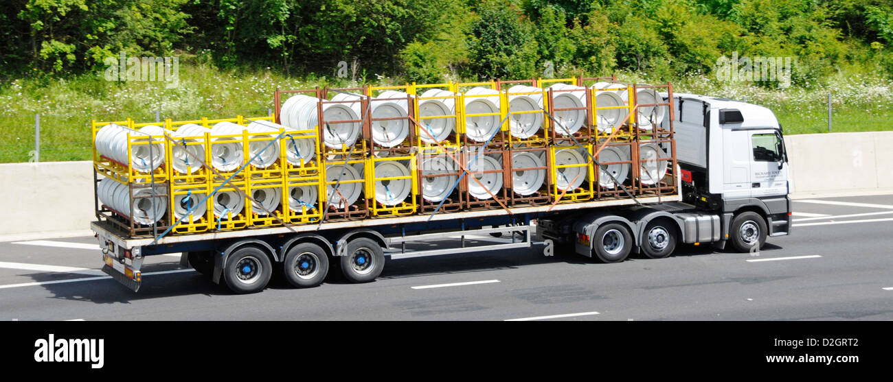 Tractor components on articulated lorry trailer Stock Photo - Alamy