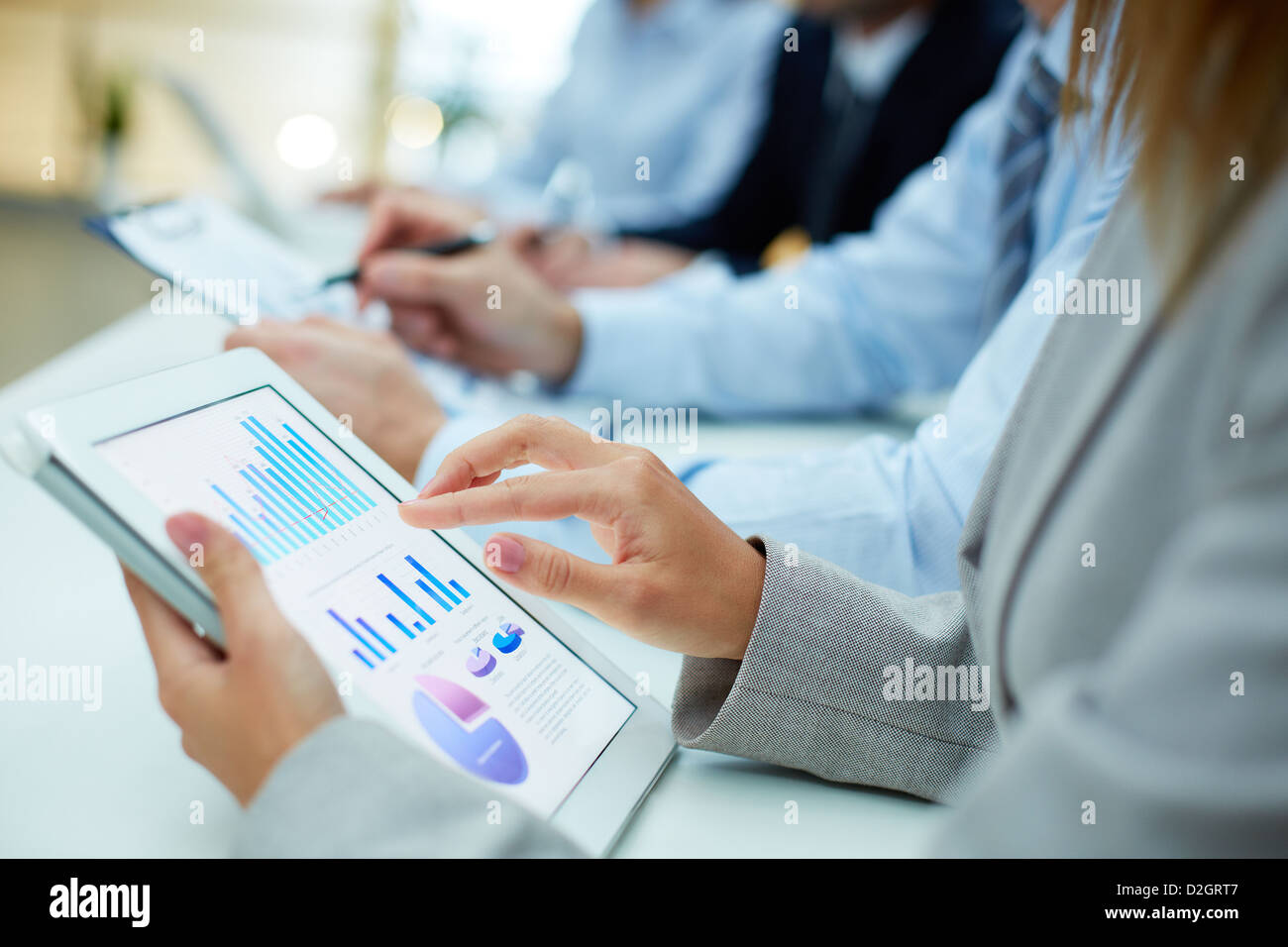 Image of human hand pointing at touchscreen in working environment at ...