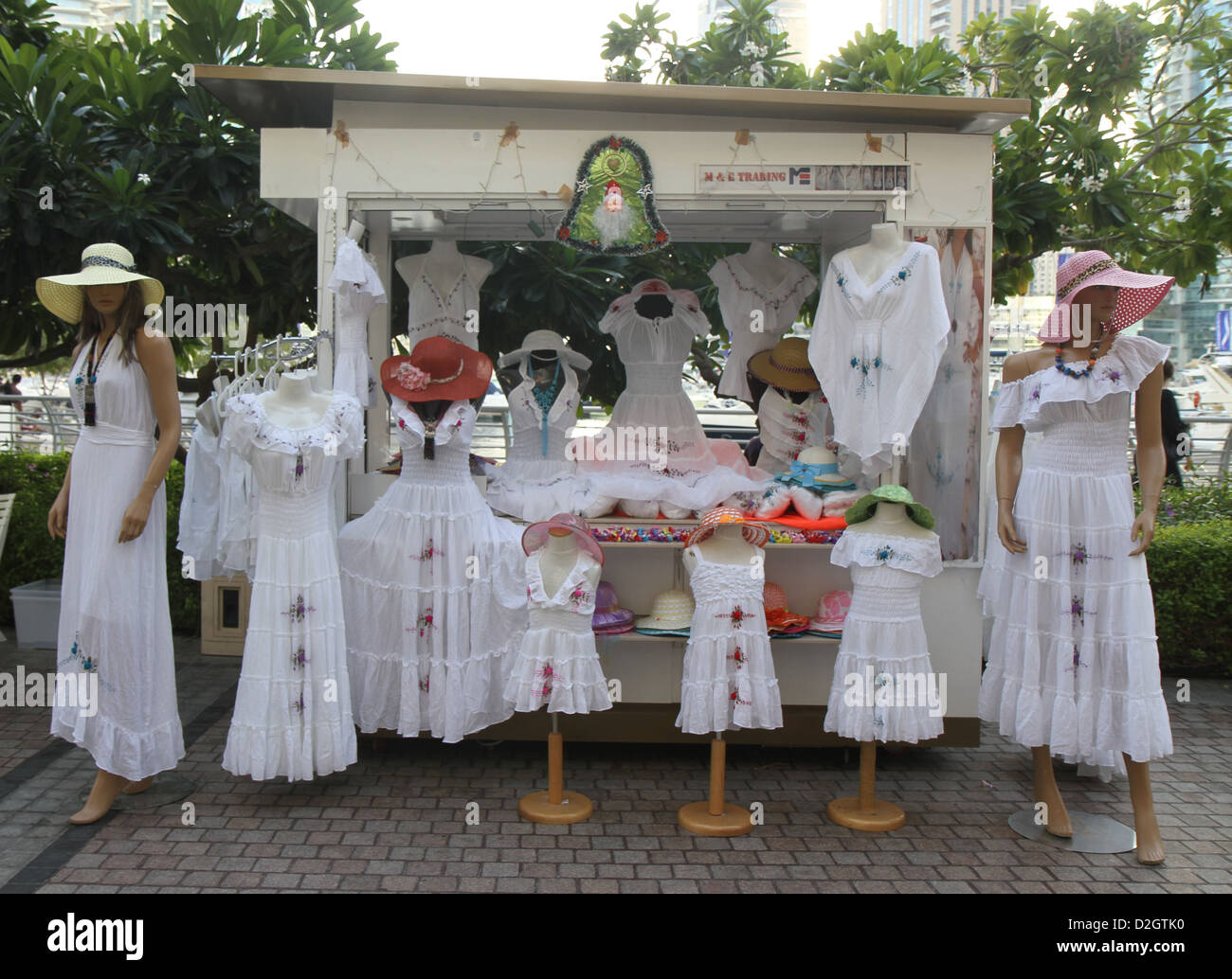 Market stall at Marina in Dubai, selling white dresses Stock Photo - Alamy