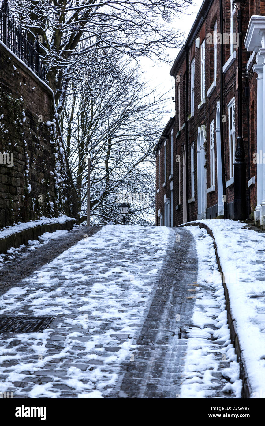 Snow Covered Cobbled Street Stock Photo - Alamy