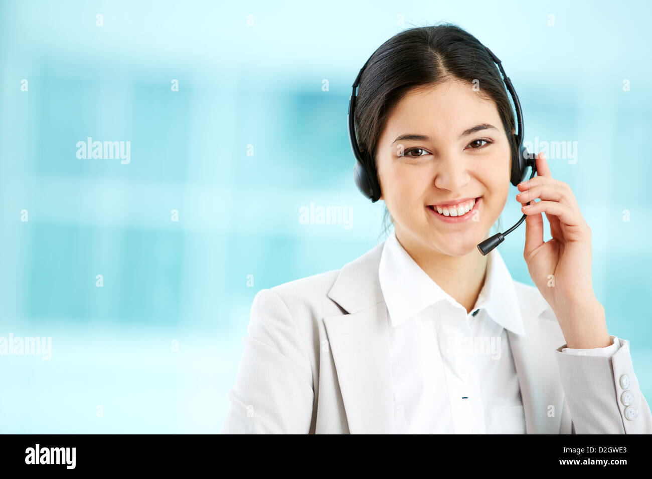 Portrait of a young customer support representative looking at camera ...